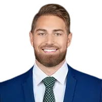 Austin Reuland | Traded Profile